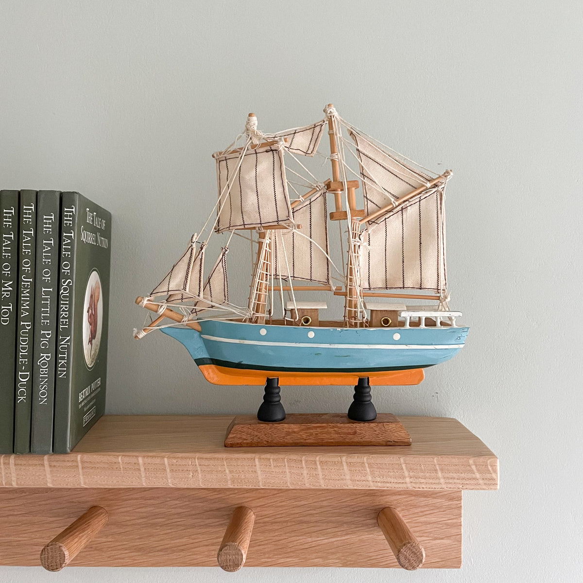 Vintage wooden model sailing ship in blue and orange, Goélette – Moppet